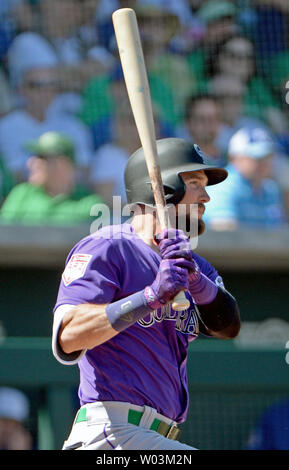 Colorado Rockies' David Dahl watches his two-run home run off Los ...