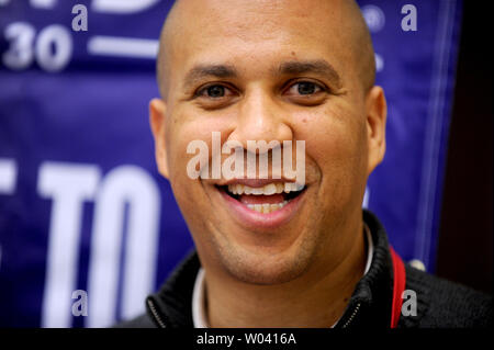 Sen. Cory Booker, D-N.J., center, speaks with visitors in Hart Senate ...
