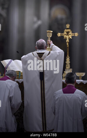 Pope Francis serves Christmas Eve Mass at midnight on December 24, 2017 ...