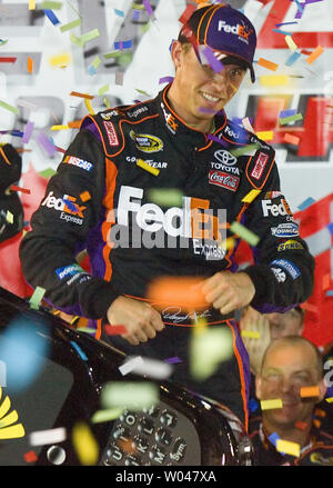 Denny Hamlin celebrates after winning the NASCAR Cup Series auto race ...
