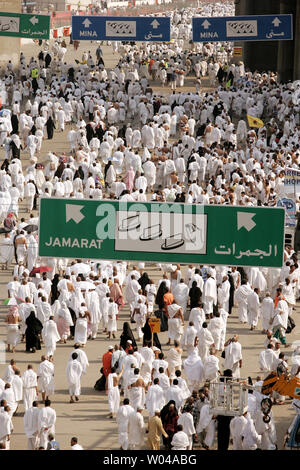 Muslim pilgrims stone one of three pillars in a ritual called 'Jamarat ...