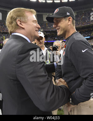 NFL Commissioner Roger Goodell greets fans as he arrives on the field ...