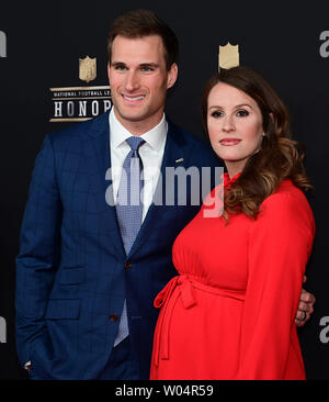 Minnesota Vikings quarterback Kirk Cousins, right, chats while arming ...
