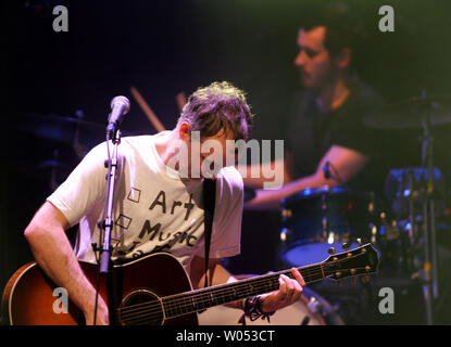 Scottish drummer Neil Primrose of Travis band, takes part in a motor ...