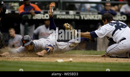 Detroit Tigers' catcher Brandon Inge, left, looks to the mound as ...