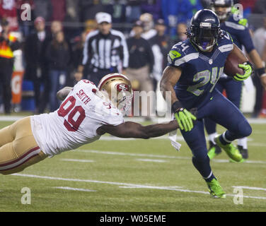 San Francisco 49ers defensive lineman Alfred Collins (95) walks on the ...