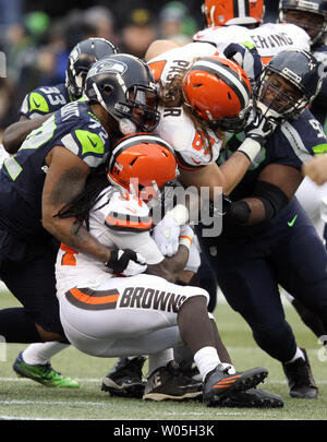 Cleveland Browns defensive end Isaiah McGuire (57) warms up before an ...