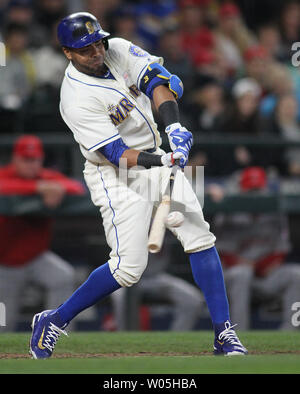 Seattle Mariners' Nelson Cruz hits an RBI-double during the first ...