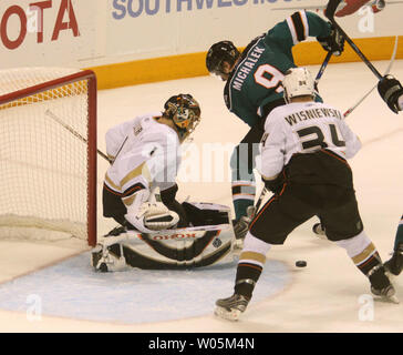 San Jose Sharks' Milan Michalek and goalie Evgeni Nabokov contain ...