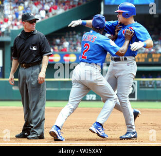 Chicago Cubs first base coach Jose Martinez, center, and first base ...