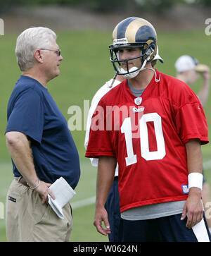 St. Louis Rams quarterback Mark Bulger prepares for a huddle in the ...