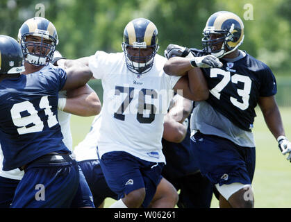 St. Louis Rams' Jimmy Kennedy sacks Arizona Cardinals quarterback Kurt ...