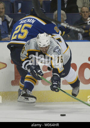 St. Louis Blues' Dennis Wideman falls over Chicago Blackhawks goalie ...