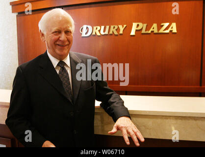 Hotel founder and owner Charles Drury (C) stands with his family ...