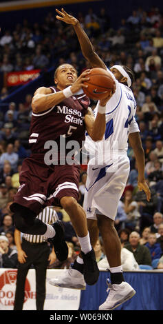 Saint Louis University Billikens Tommie Liddell (L) gets tied up with ...