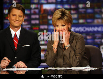 KSDK Newschannel 5 anchor Karen Foss, watches a video piece on adoption ...