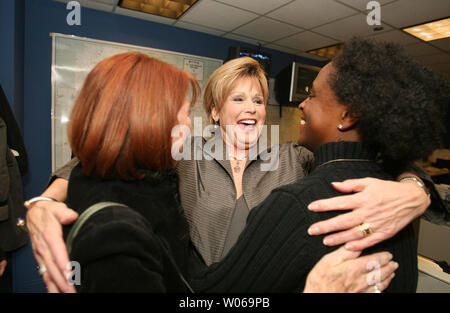 KSDK Newschannel 5 anchor Karen Foss, watches a video piece on adoption ...
