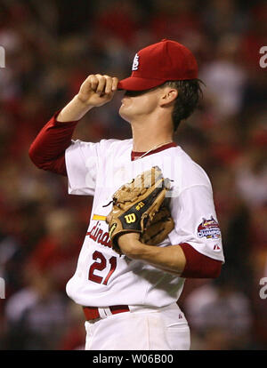 Alex Gonzalez of the Cincinnati Reds can't handle the throw as Rafael ...