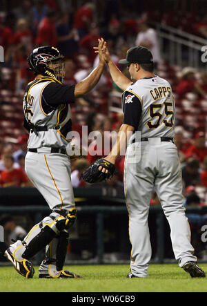 Pittsburgh Pirates pitcher Matt Capps walks alone in the dugout after a ...