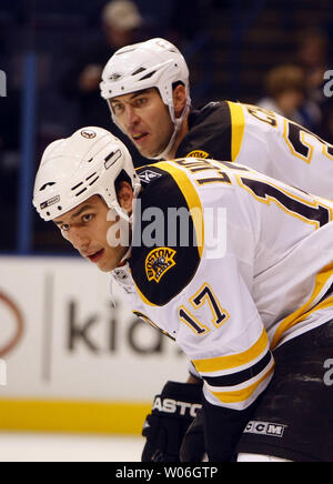 Boston Bruins' Milan Lucic (17) celebrates with Marc Savard (91), Shane ...