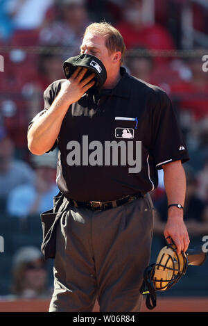 Home Plate Umpire Bruce Dreckman takes off his mask between innings ...