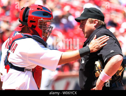 Home Plate Umpire Bruce Dreckman takes off his mask between innings ...