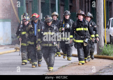 Firefighters battle a six-alarm fire at a racquet club at the ...