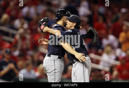 Seattle Mariners pitcher Danny Farquhar jokingly strikes a pose with ...