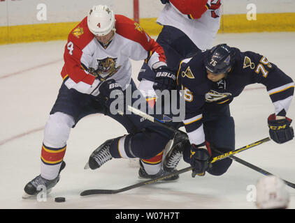 St. Louis Blues center Dylan Holloway (81) works the puck against the ...
