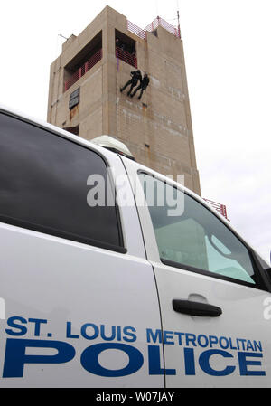 St. Louis Fire Department Rescue Squad 2 member Ruben Micich works to ...
