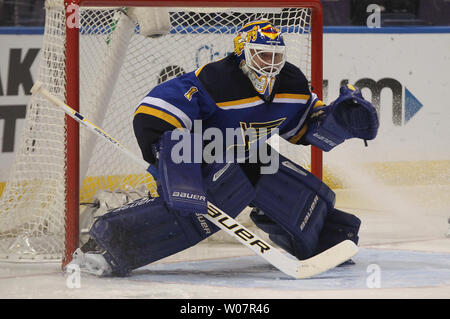St. Louis Blues goaltender Brian Elliott makes a pad save as New York ...