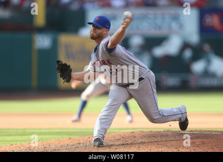 New York Mets pitcher Josh Edgin flips a ball home during a drill at ...