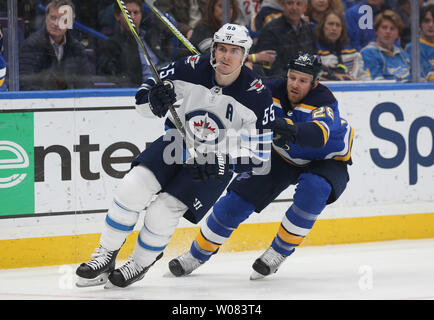 Winnipeg Jets center Mark Scheifele (55) tangles with Colorado ...