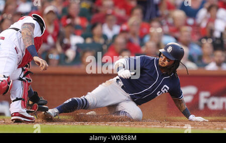 San Diego Padres catcher Freddy Fermin, left, pats starting pitcher ...