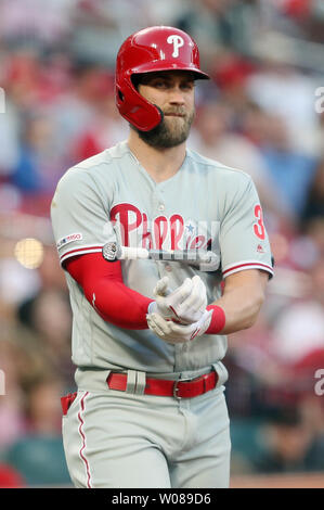 Philadelphia Phillies' Bryce Harper walks to the dugout after striking ...
