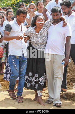 Family members weep during the funeral ceremony of Major Ilay Levy at ...