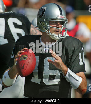 Oakland Raiders QB Andrew Walter (16) scrambles to elude pressure from ...