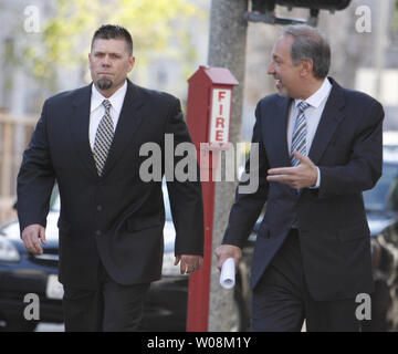 Greg Anderson, Barry Bonds' former trainer (L) walks with attorney Mark ...