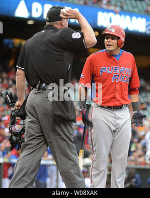 Home plate umpire Ted Barrett, center, steps in between Arizona ...