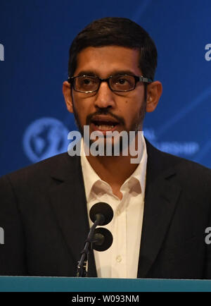 (L-R) Google CEO Sundar Pichai speaks with Tesla and SpaceX CEO Elon ...