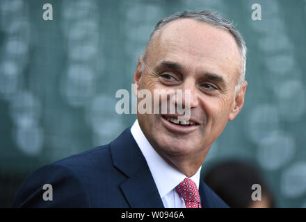 Baseball Commissioner Rob Manfred smiles during the Baseball Hall of ...