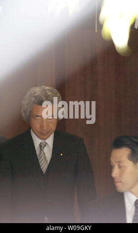 TOKYO, Japan - Prime Minister Junichiro Koizumi leaves the home of ...