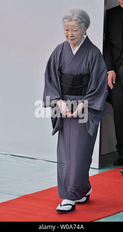 TOKYO, Japan - Empress Michiko (R) attends an exhibition of picture ...