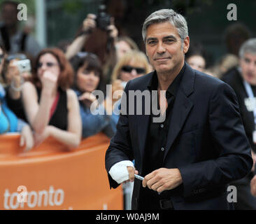 George Clooney walks the red carpet at the premiere of "Oceans 13 ...