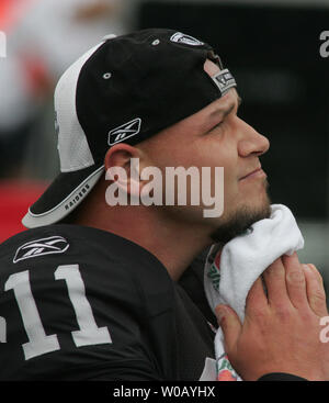 Oakland Raiders kicker, Sebastian Janikowski (wearing baseball hat ...