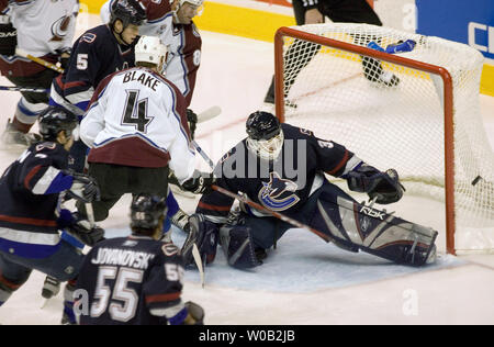 Vancouver Canucks goalie Dan Cloutier makes a save on a Edmonton Oilers ...
