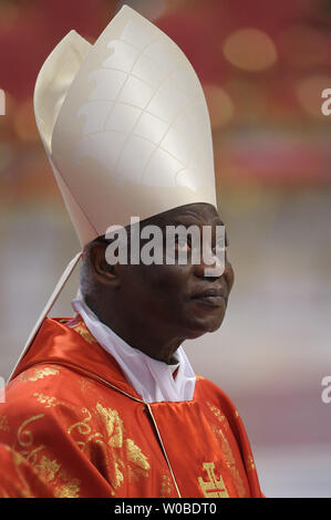 Ghanaian Cardinal Peter Kodwo Appiah Turkson, center, attends a Mass ...