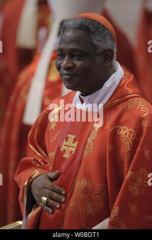 Ghanaian Cardinal Peter Kodwo Appiah Turkson, center, attends a Mass ...