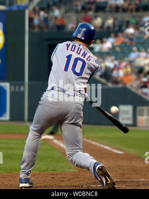 Texas Rangers Michael Young hits an infield single in the third inning ...