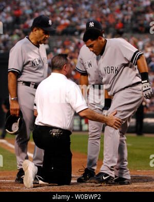 New York Yankees trainer Mark Littlefield, left, and manager Joe ...